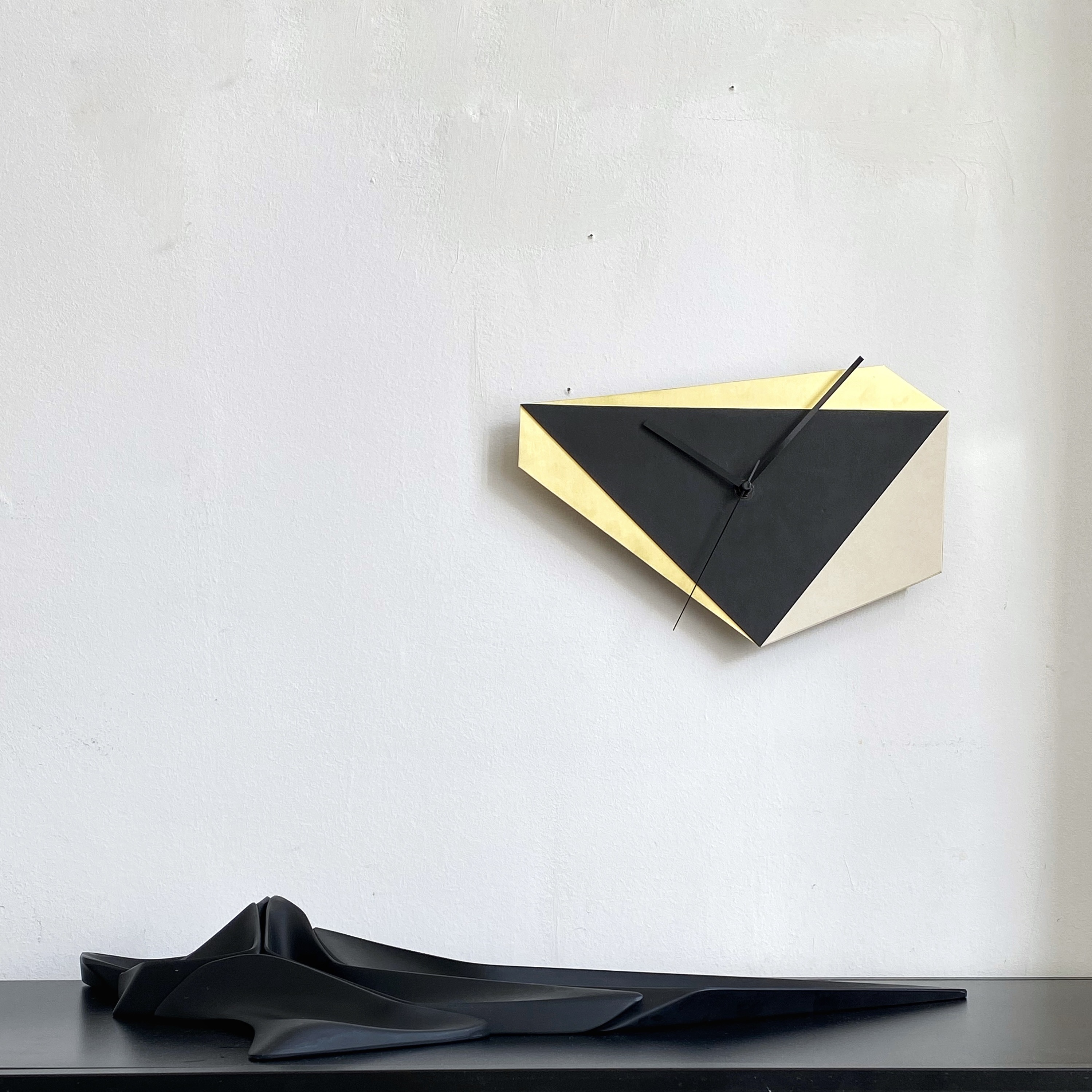 Abstract clock in golden black and white • Jagged Squares
